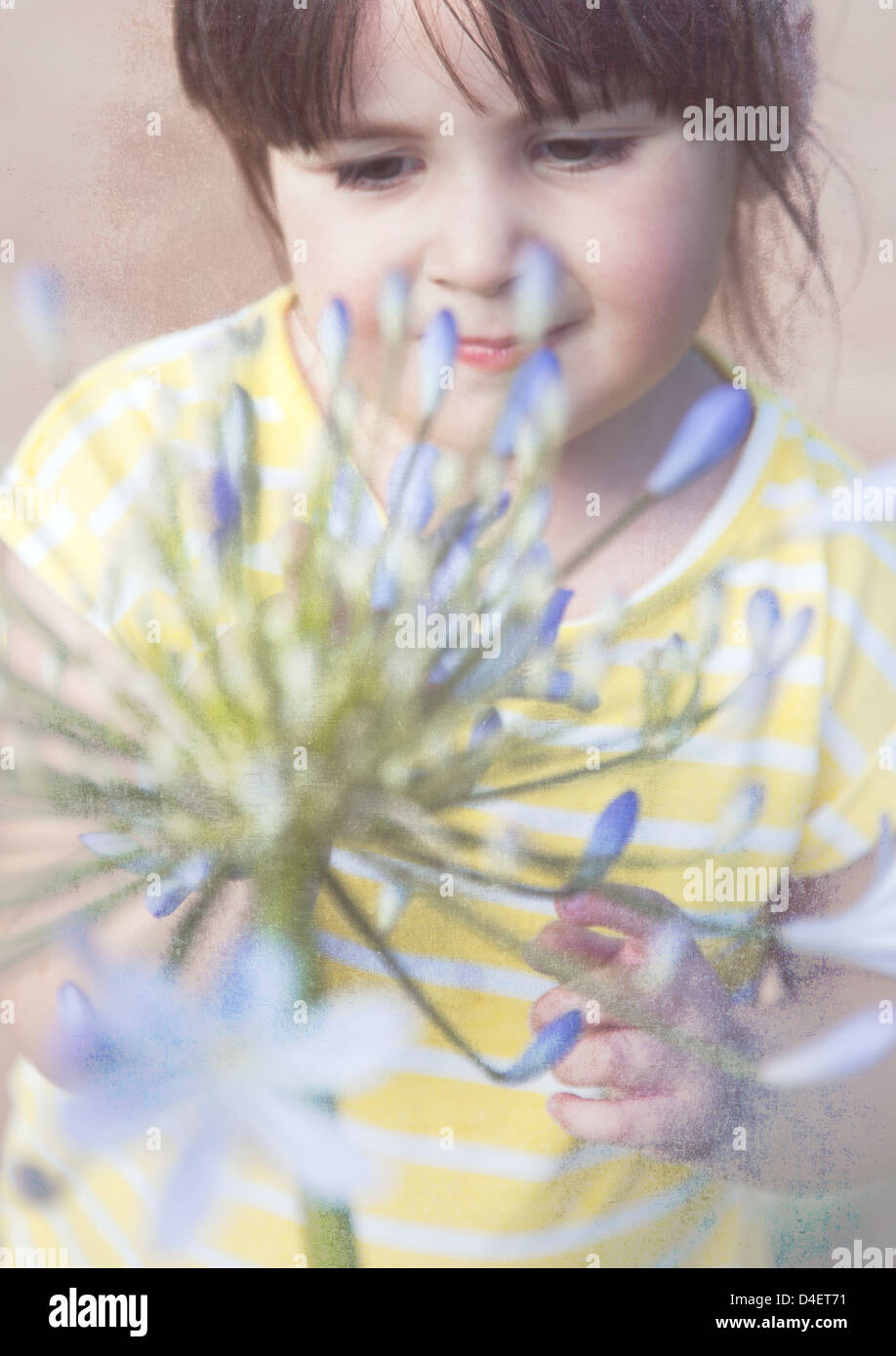 Girl reaching Flower Stock Photo - Alamy