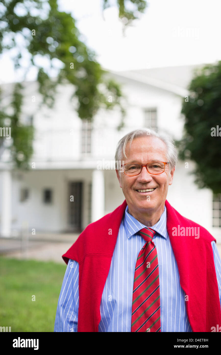 Man smiling outside house Stock Photo - Alamy