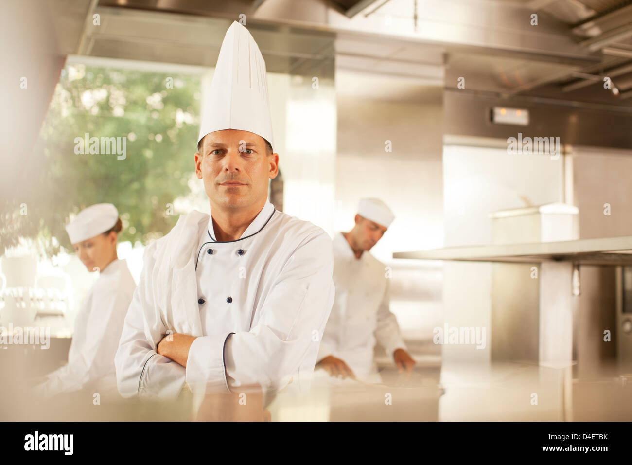 Chef standing in restaurant kitchen Stock Photo - Alamy