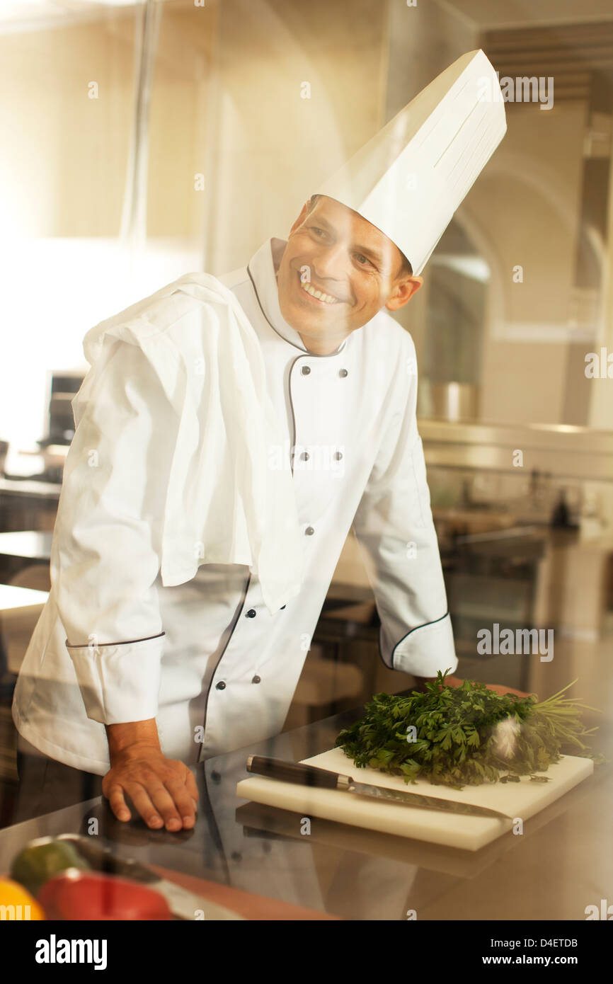 Chef smiling in restaurant kitchen Stock Photo - Alamy