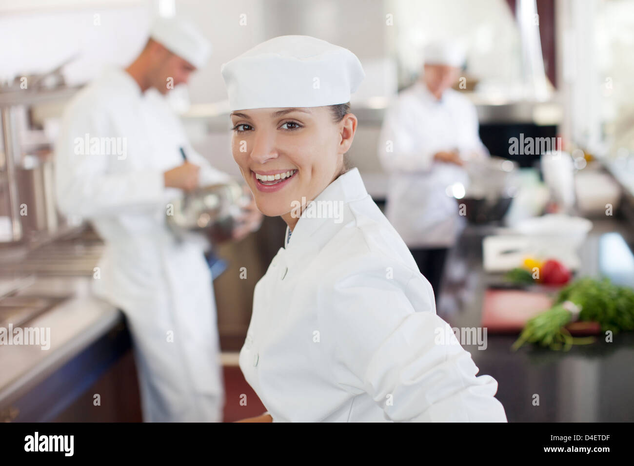 Chef smiling in restaurant kitchen Stock Photo - Alamy