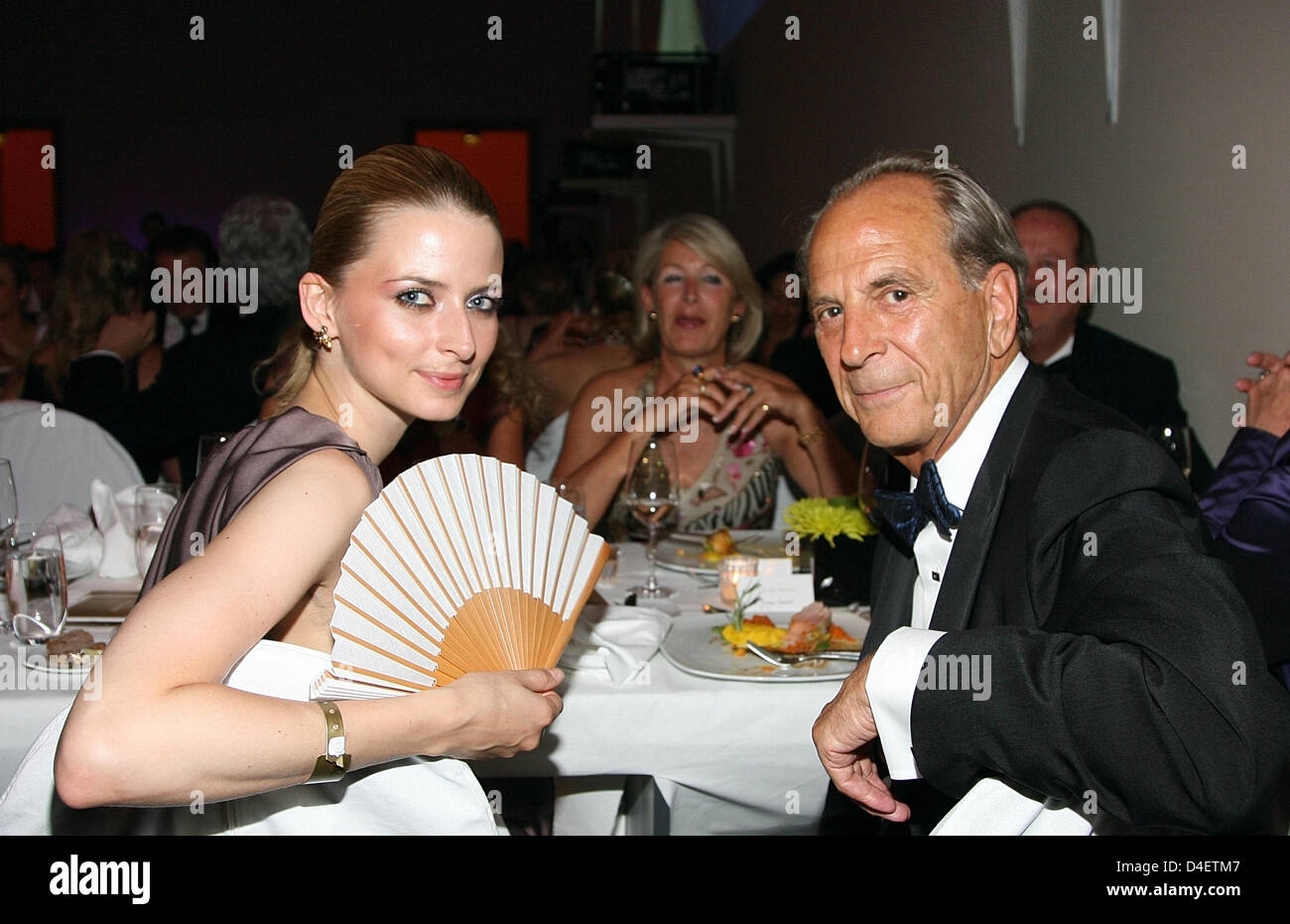 German model Eva Padberg (L) and Juergen Heraeus, chairman of UNICEF Germany, smile during the ...