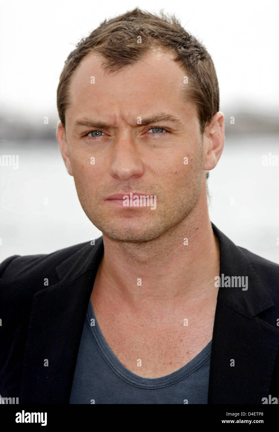 British actor Jude Law poses for photos during a beach front photo call ...