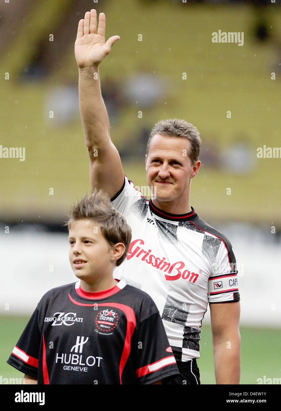 Former Formula One world champion German Michael Schumacher waves to ...