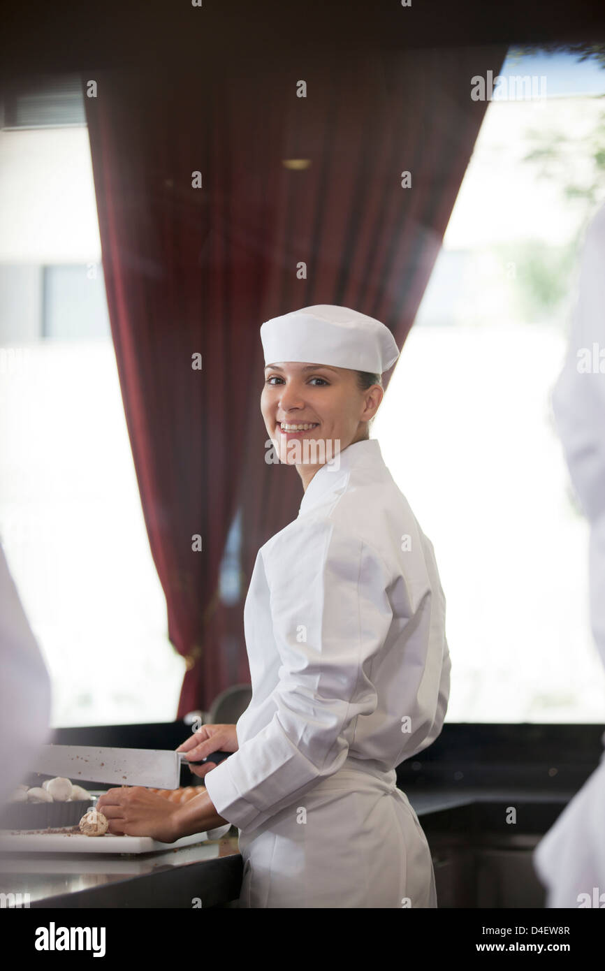 Chef chopping in restaurant kitchen Stock Photo - Alamy