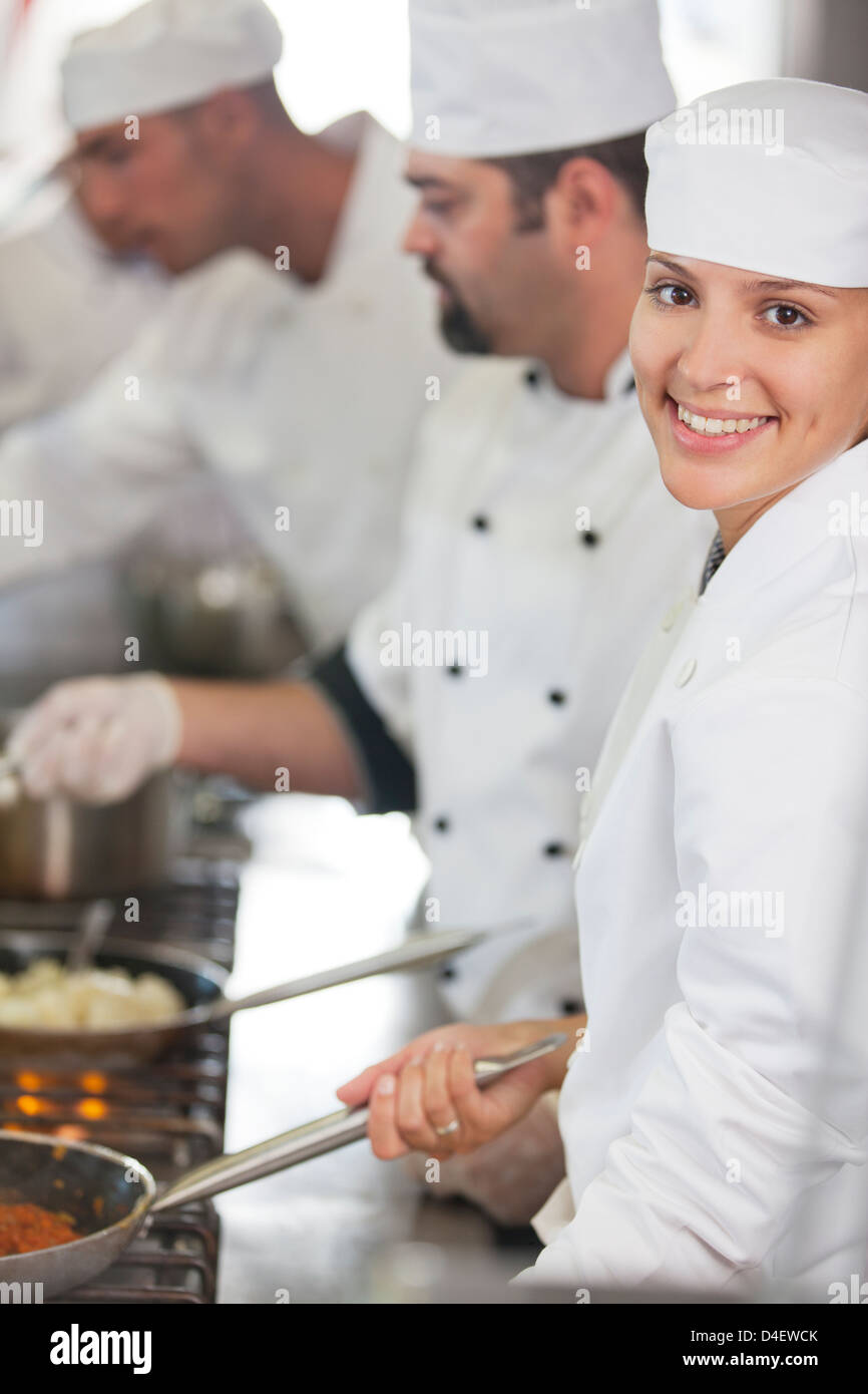 Chefs cooking in restaurant kitchen Stock Photo - Alamy