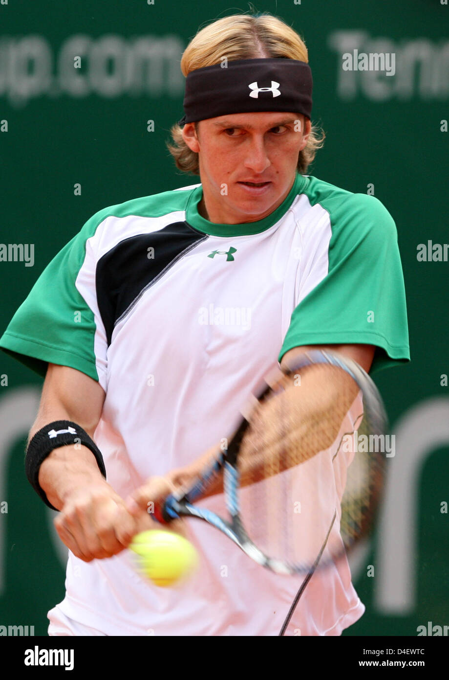 Igor Andreev of Russia returns a backhand to Feliciano Lopez of Spain ...