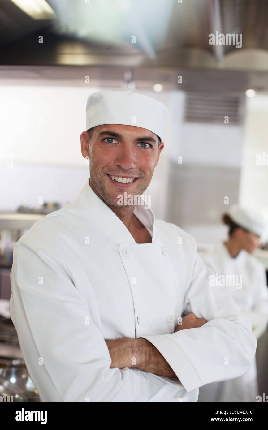 Chef smiling in restaurant kitchen Stock Photo - Alamy