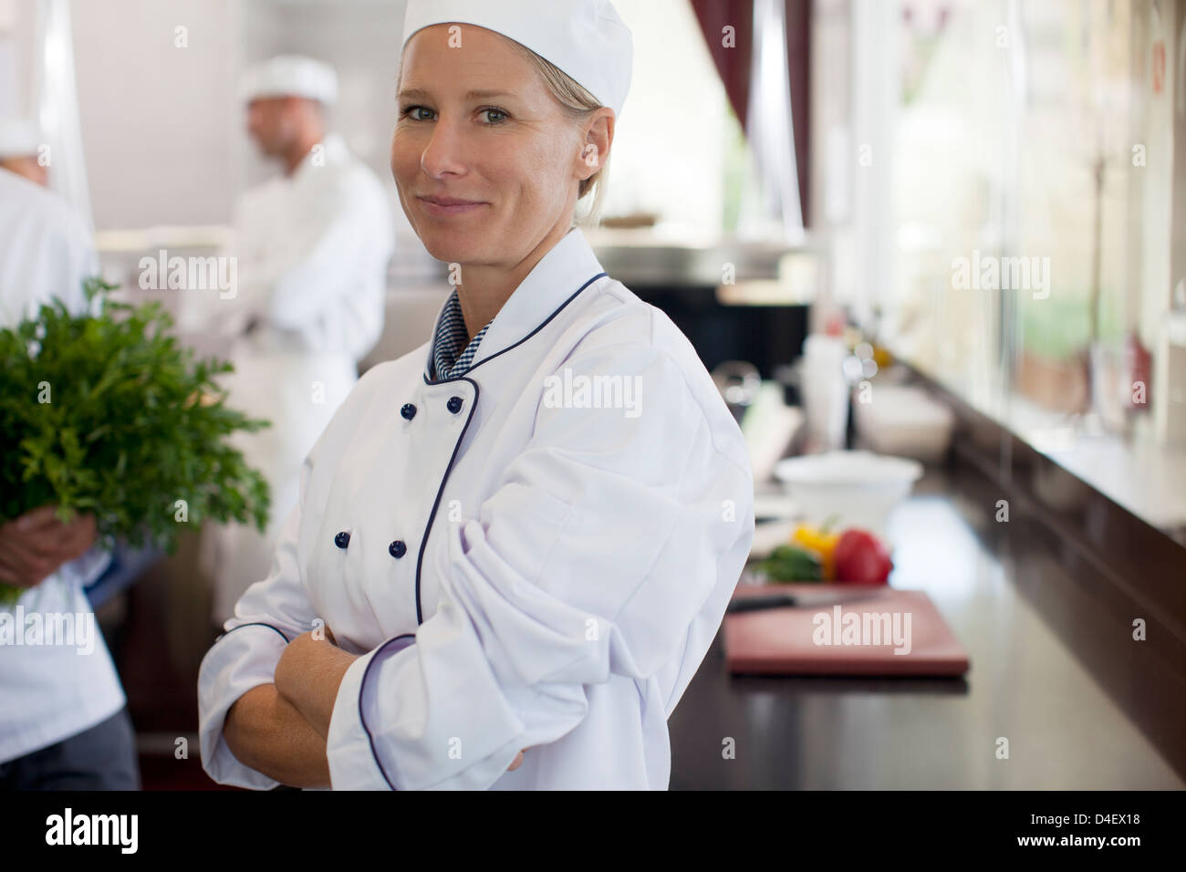 Chef smiling in restaurant Stock Photo - Alamy