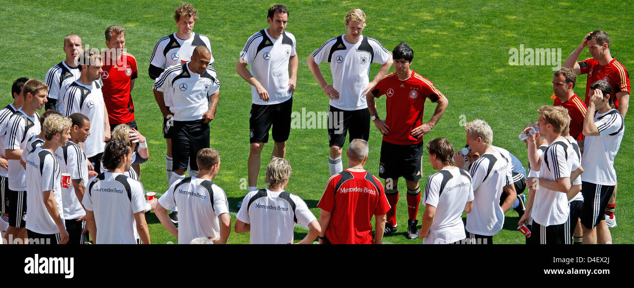 German national head coach Joachim Loew (C) adresses his players his ...