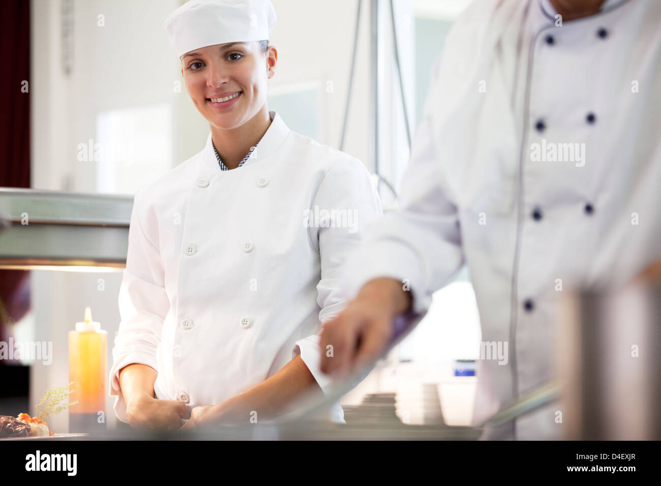 Chefs cooking in restaurant kitchen Stock Photo - Alamy