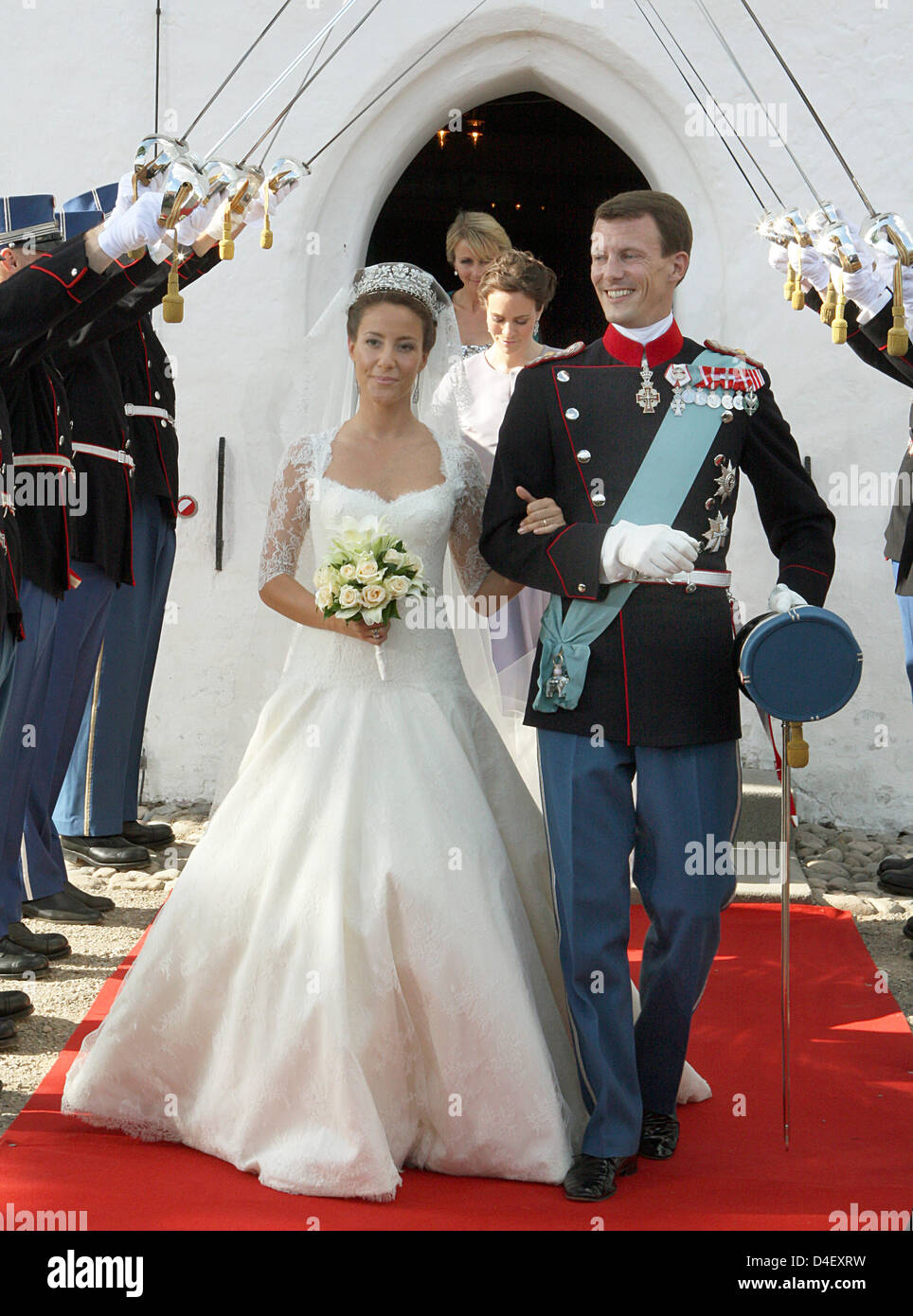 Prince Joachim of Denmark (R) and wife Princess Marie (L) merrily leave ...