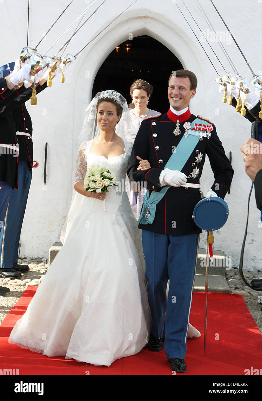 Prince Joachim of Denmark (R) and wife Princess Marie (L) merrily leave ...