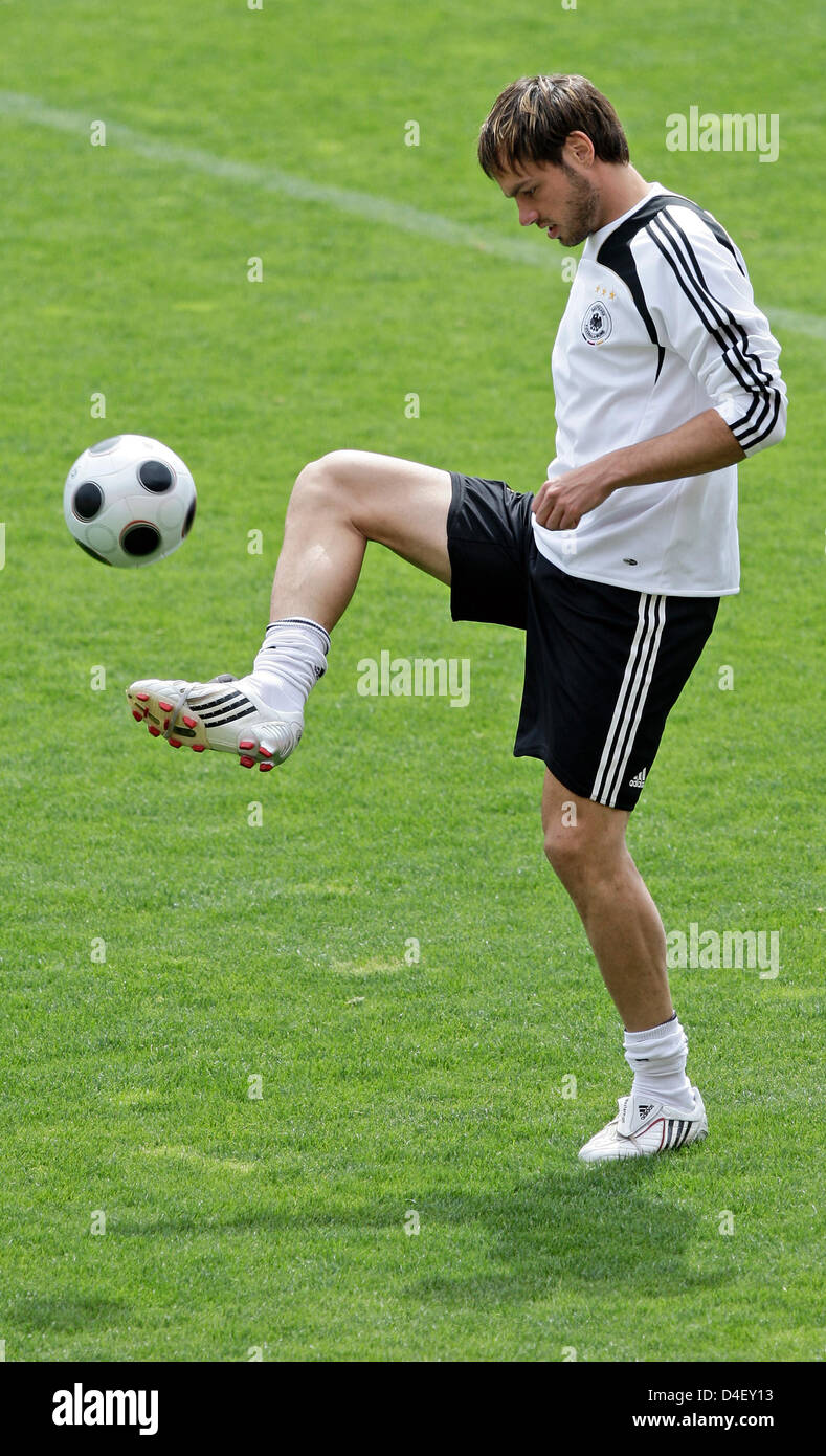 German international centre-back Heiko Westermann balances the ball ...
