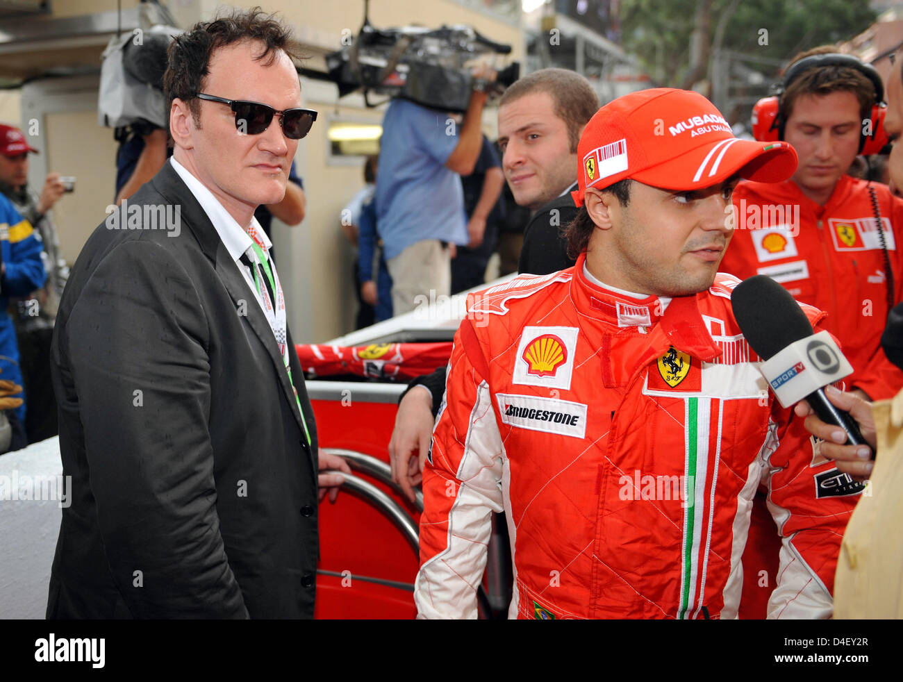 Brazilian Formula One driver Felipe Massa of Scuderia Ferrari (R) gives ...