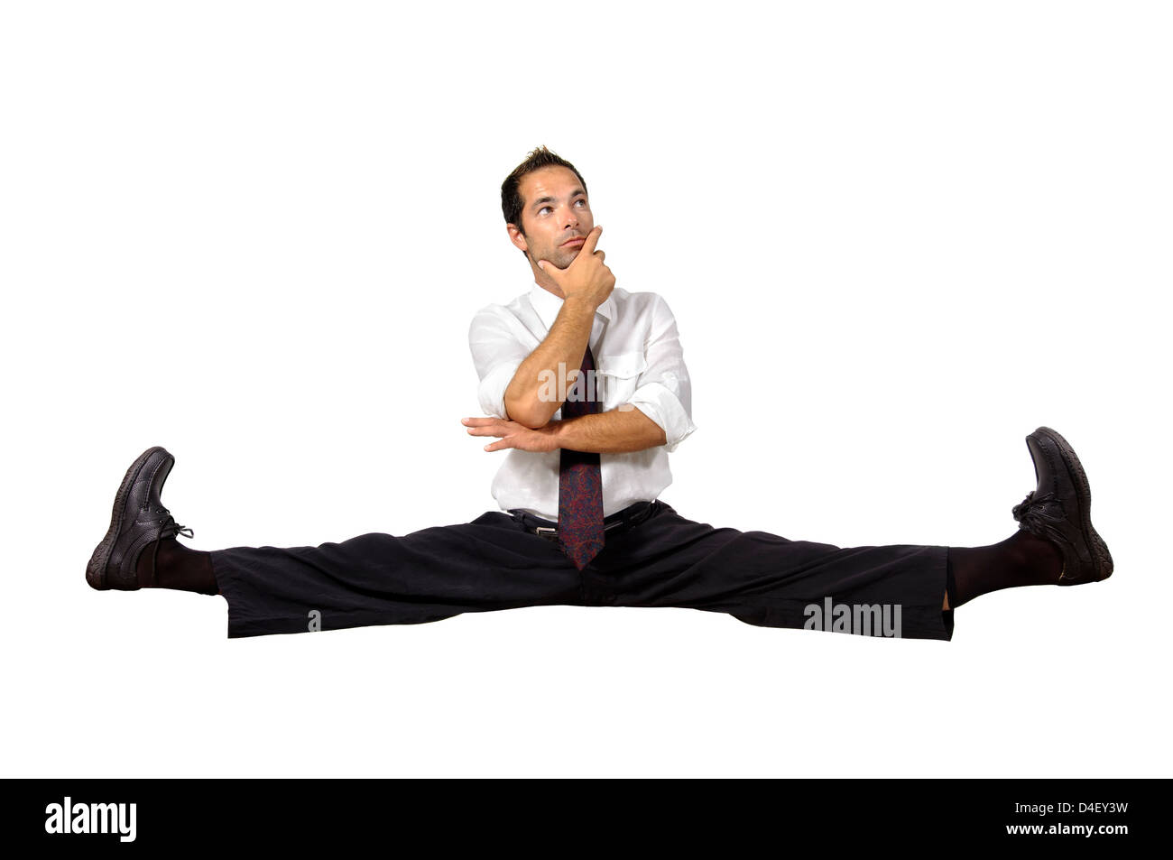 Businessman doing splits isolated in white Stock Photo - Alamy