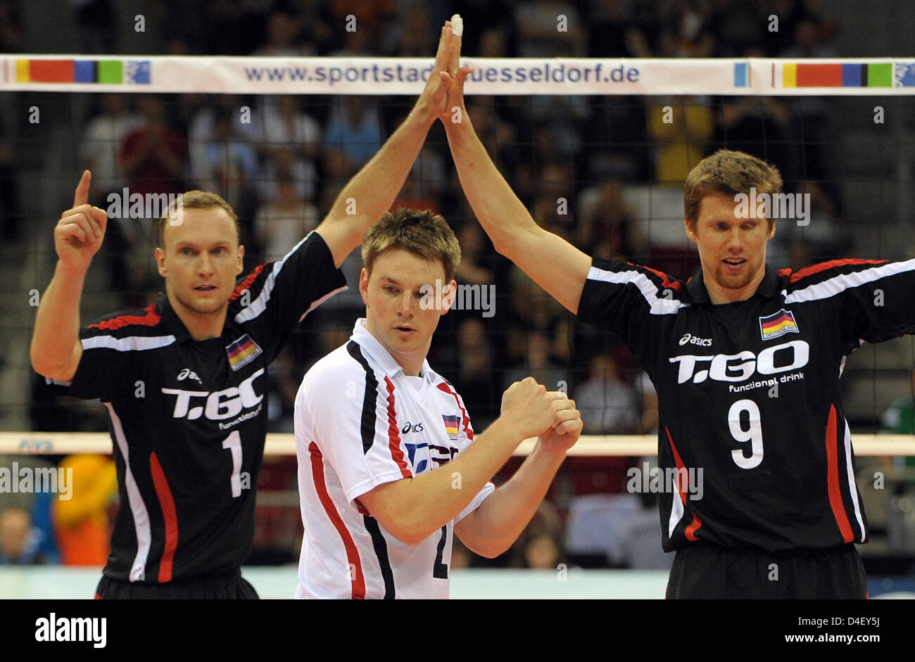 Germany's Marcus Popp, Markus Steuerwald and Stefan Huebner cheer a ...