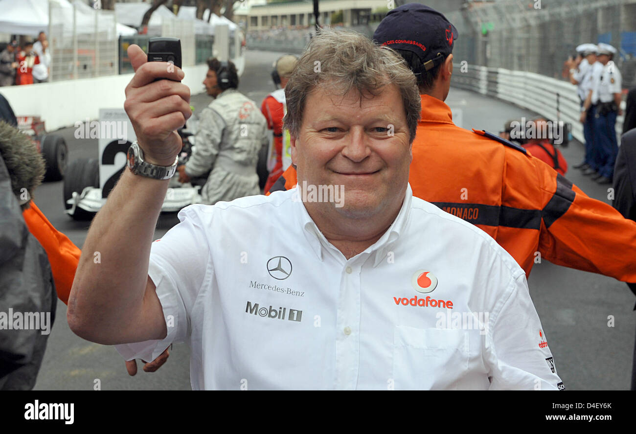 Mercedes Motorsport Director Norbert Haug celebrates winning the rainy ...