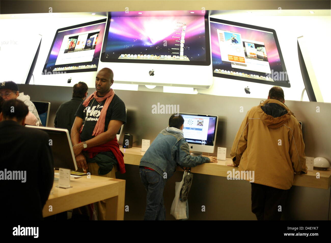 Customers check out Apple stuff in the Apple Store open 24-7 on 5th ...