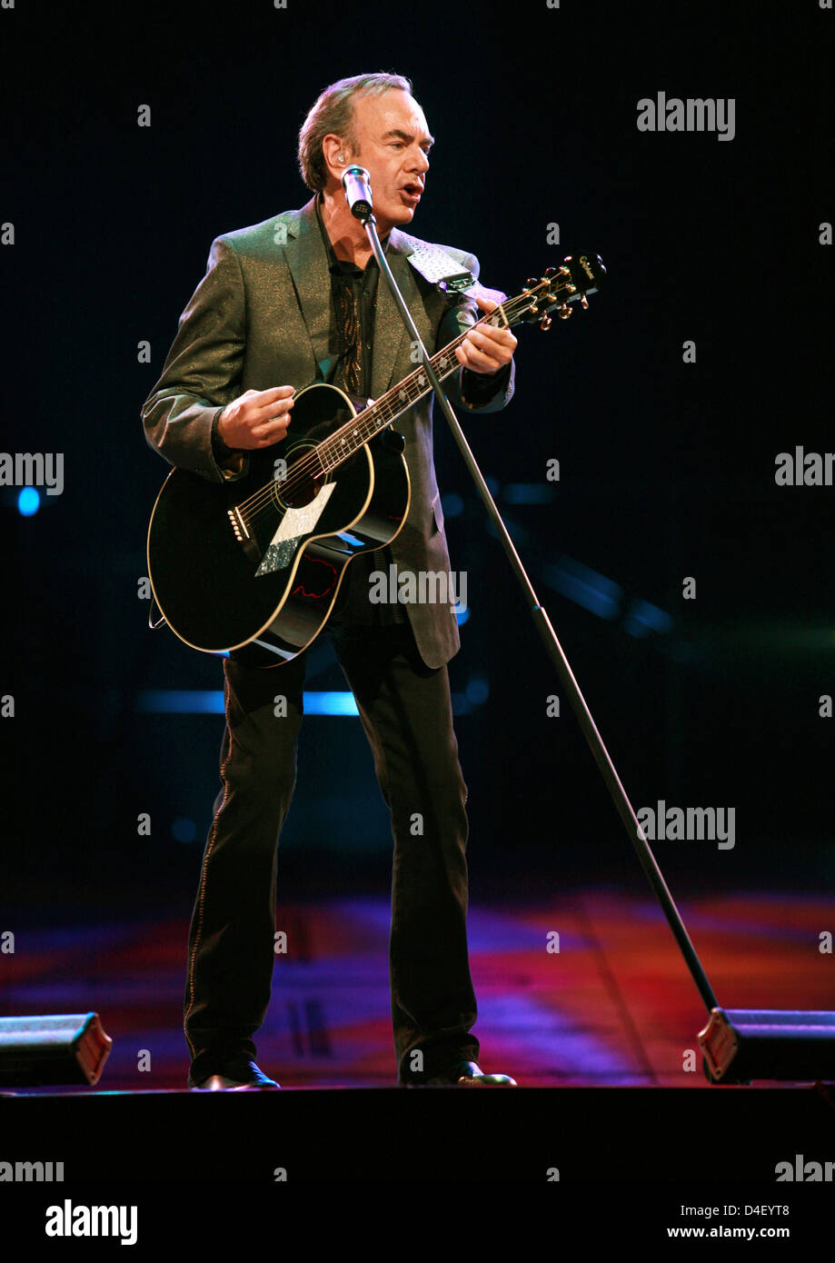 Singer/songwriter and guitarist Neil Diamond performs on stage in the ...