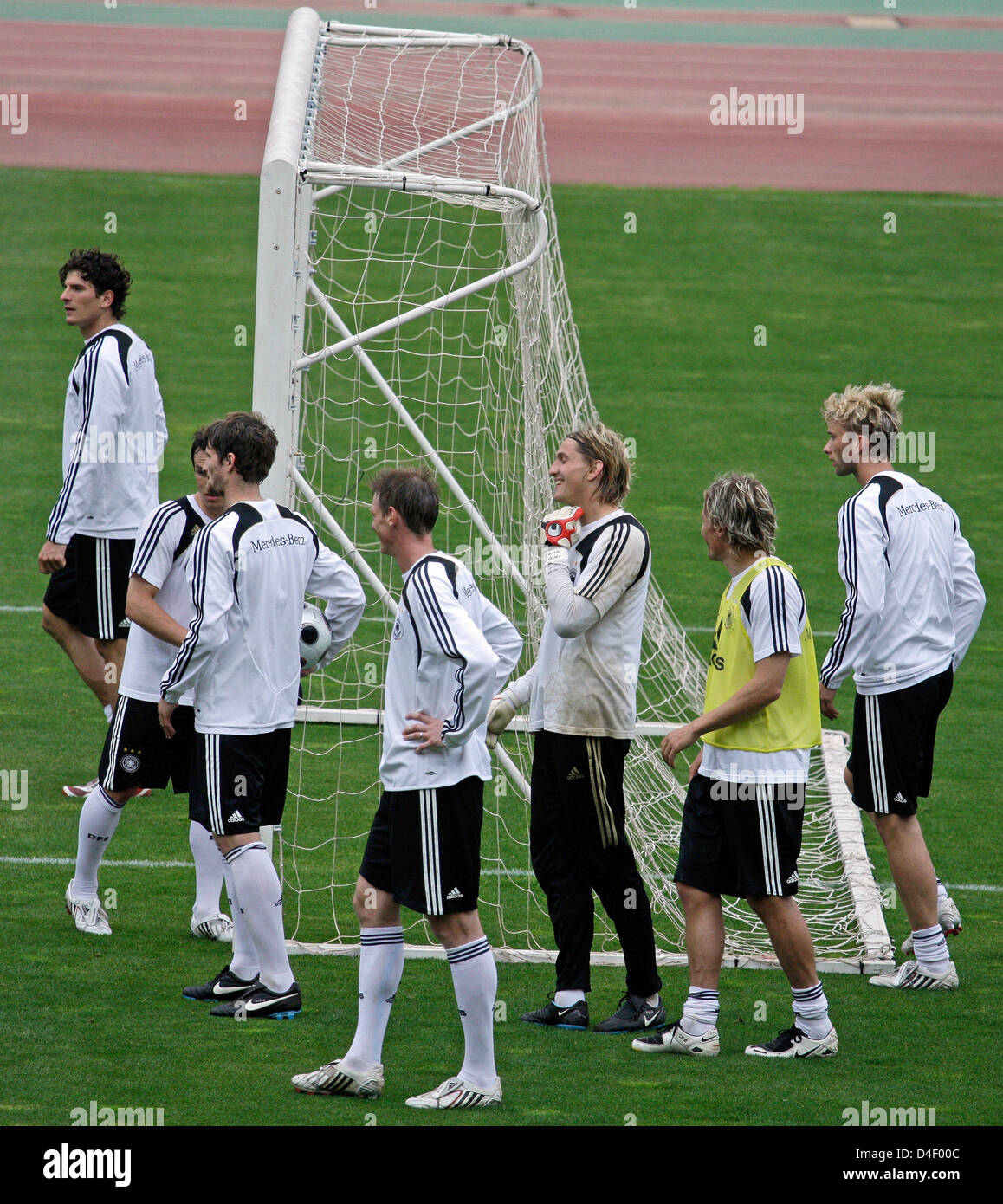 Players of the German national team gather around a goal during ...