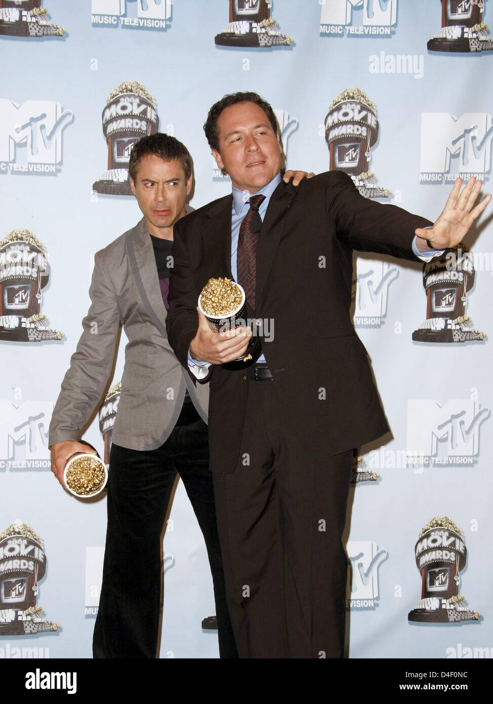 Actor Robert Downey Jr. (L) and director Jon Favreau pose at the 2008 ...