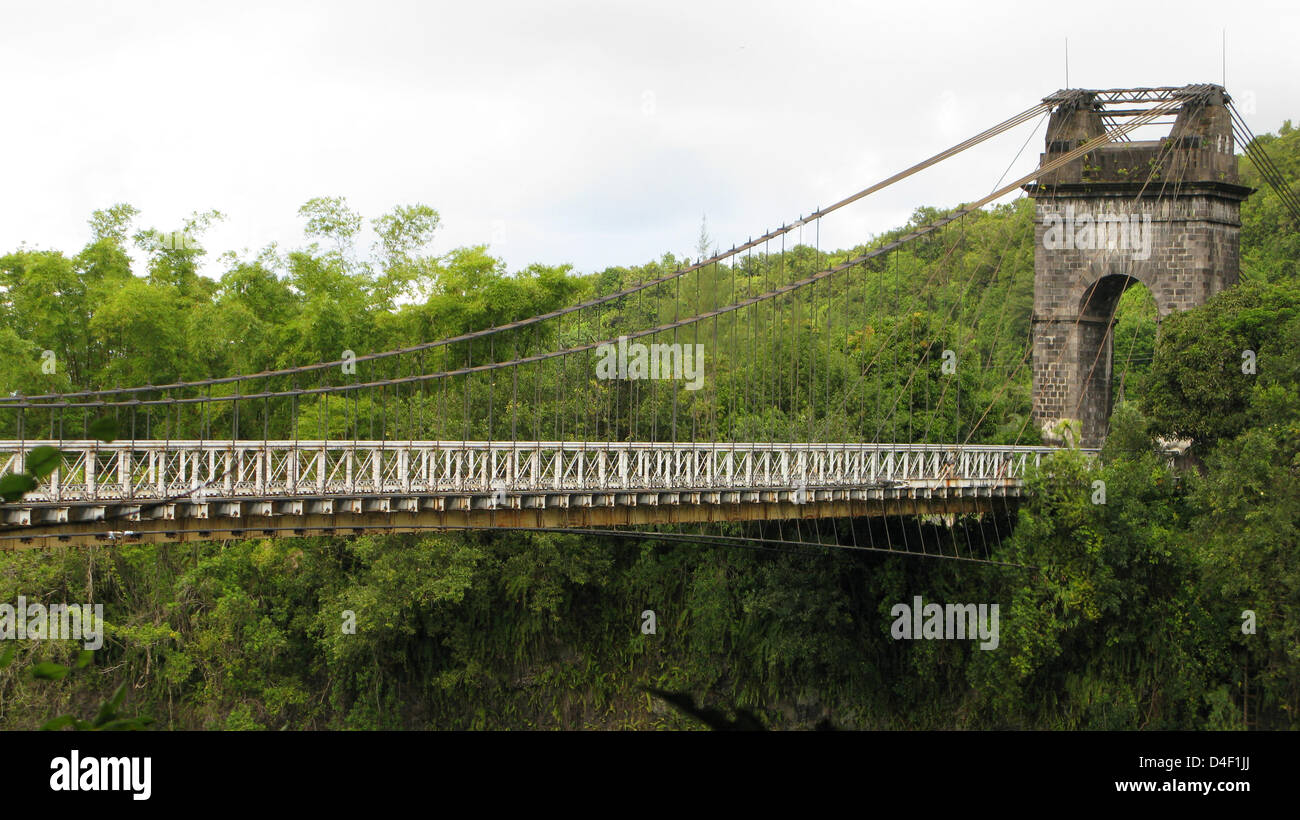 A suspension bridge built in 1893 pictured near St. Anne on Reunion ...