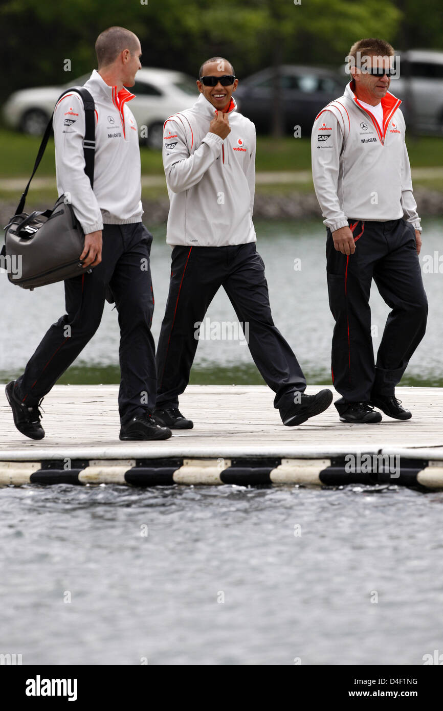 Lewis hamilton arrives in the paddock hi-res stock photography and ...