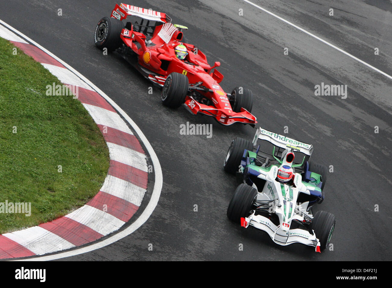 Brazilian Formula One driver Rubens Barrichello of Honda (front) and ...
