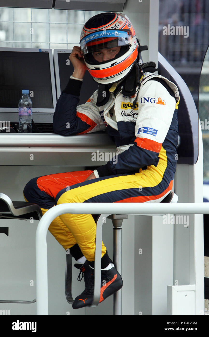 Brazilian Formula One driver Nelson Piquet jr. of Renault sits on the ...