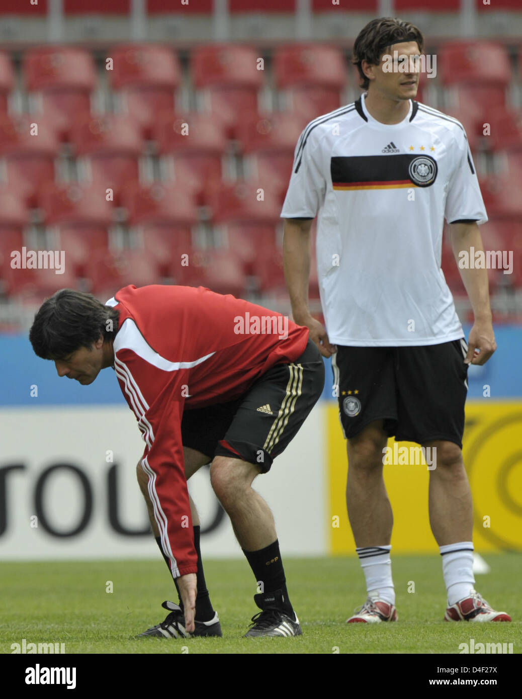 German national soccer coach Joachim Loew and team's player Mario Gomez ...