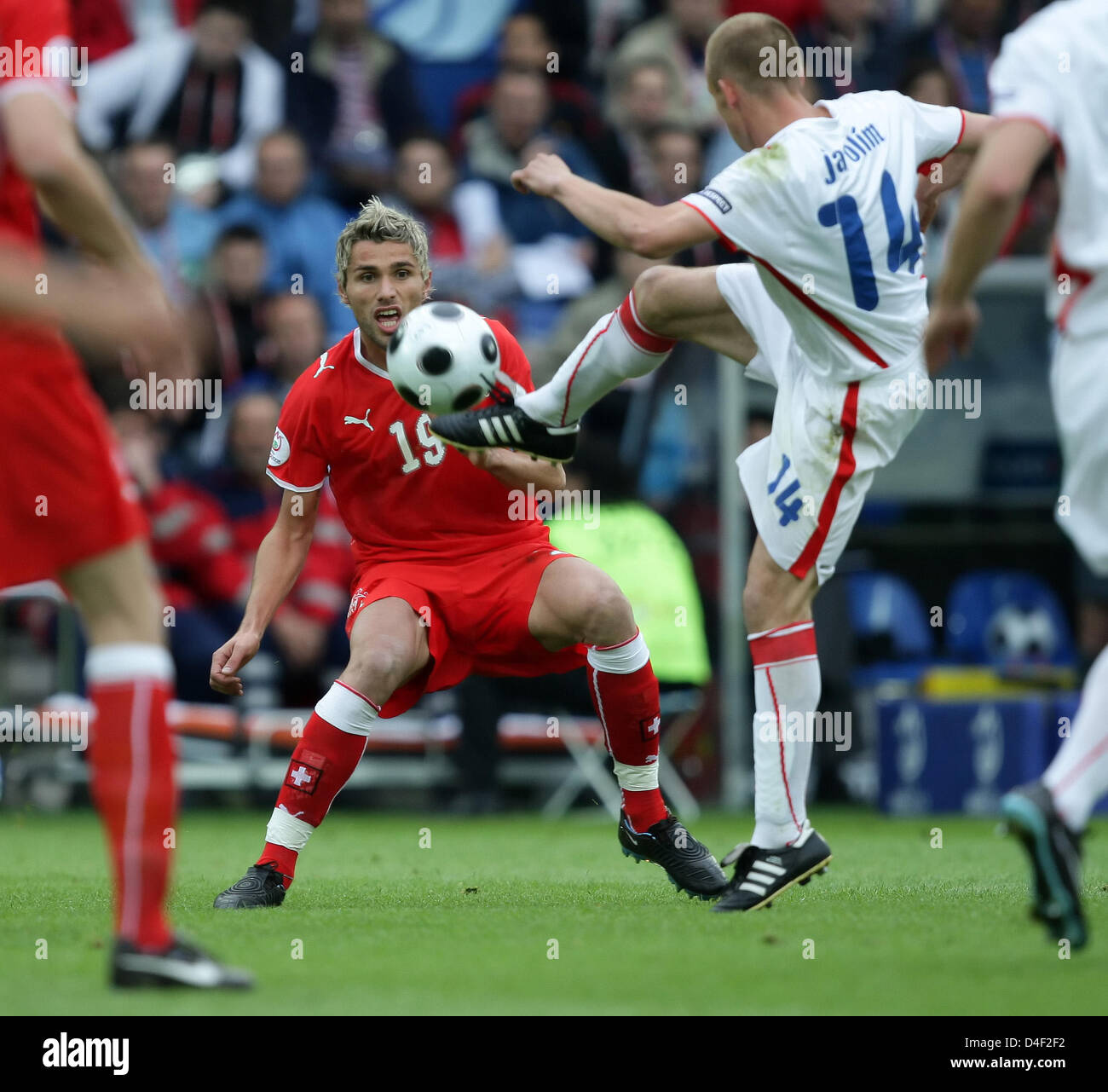 Valon Behrami of Switzerland vies with David Jarolim of Czech Republic ...