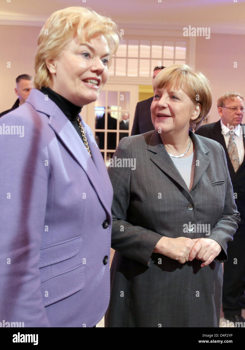 German Chancellor Angela Merkel talks to President of the Federation of ...