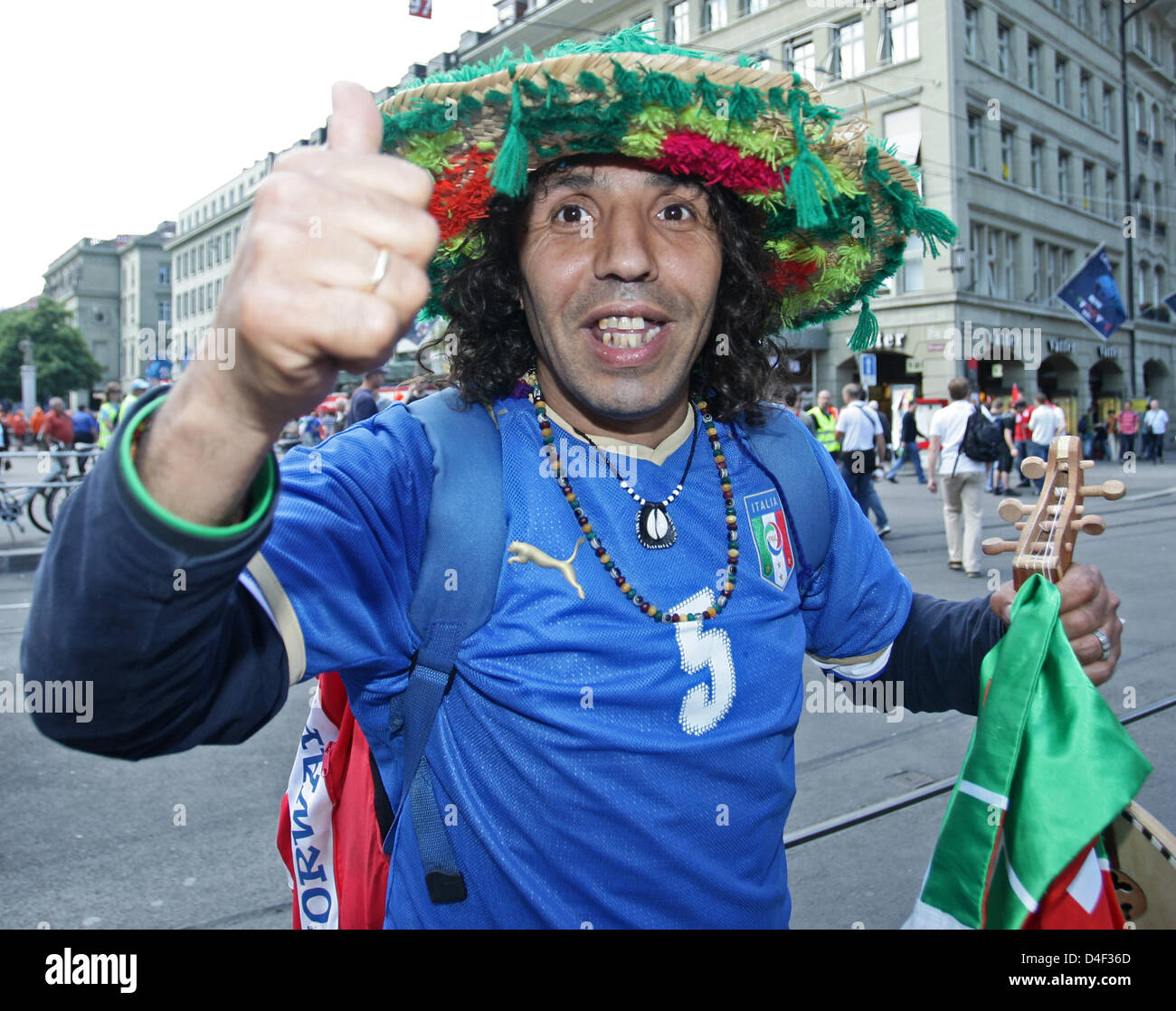 A Supporter of the Italien soccer team celebrates in downtown Berne ...