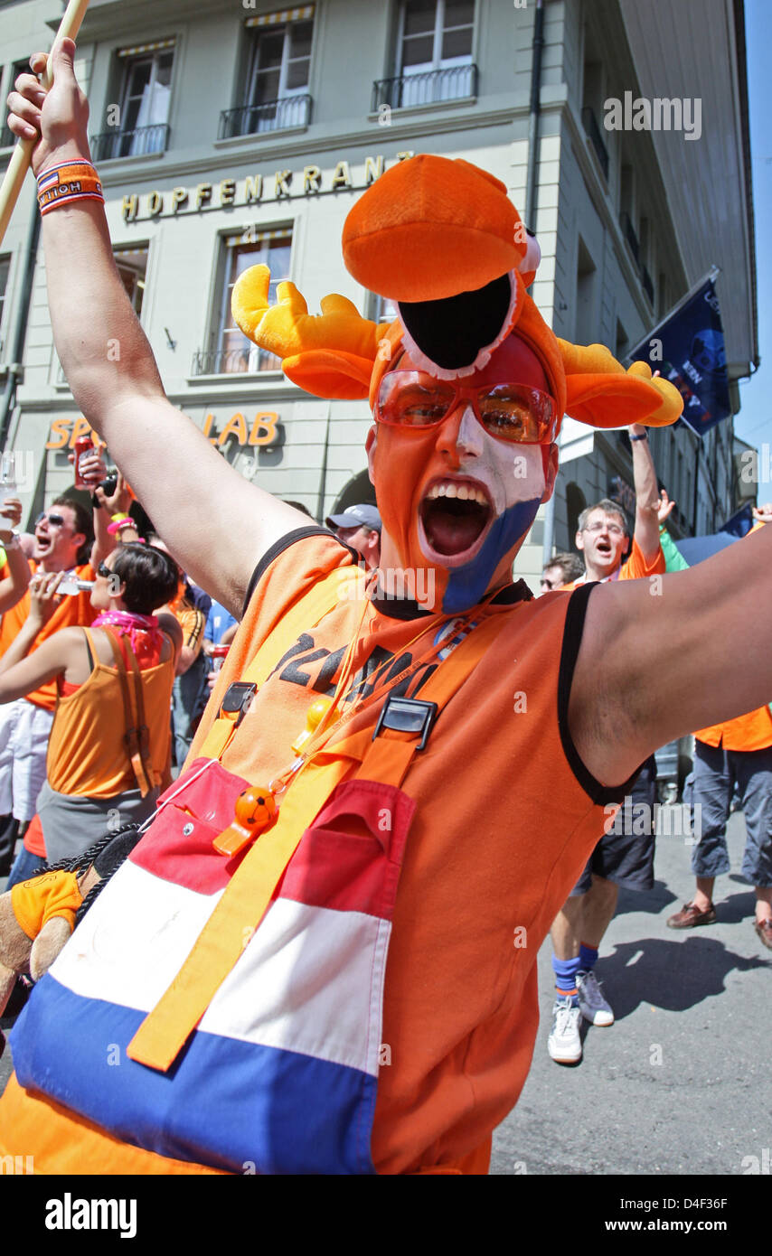 A Supporter of the Dutch soccer team celebrates in downtown Berne prior ...