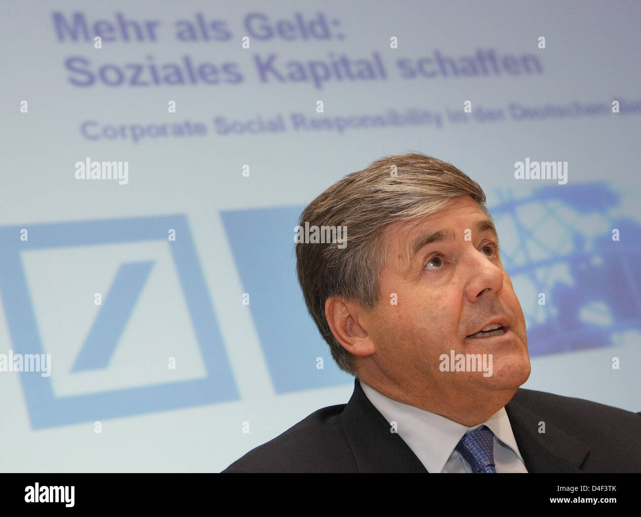 Deutsche-Bank CEO Josef Ackermann seen in front of a screen reading ...
