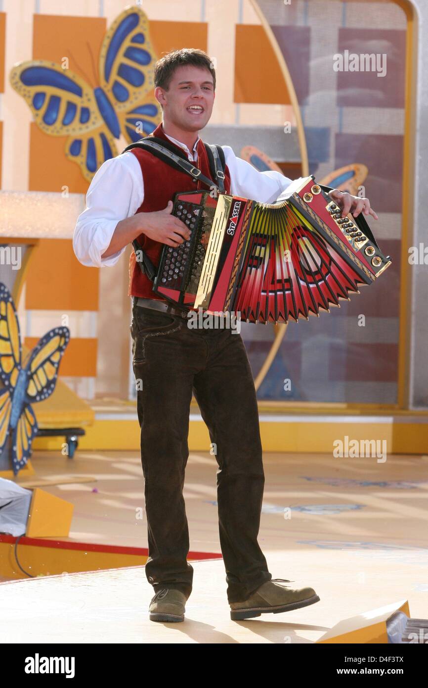 Accordion player 'Flo' poses at the music show 'Immer wieder Sonntags ...