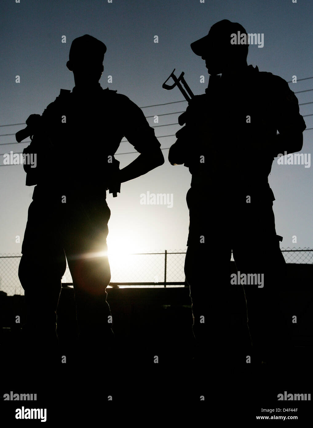 Two armed soldiers guard the inaugration of 'Jenin Vocational Training ...