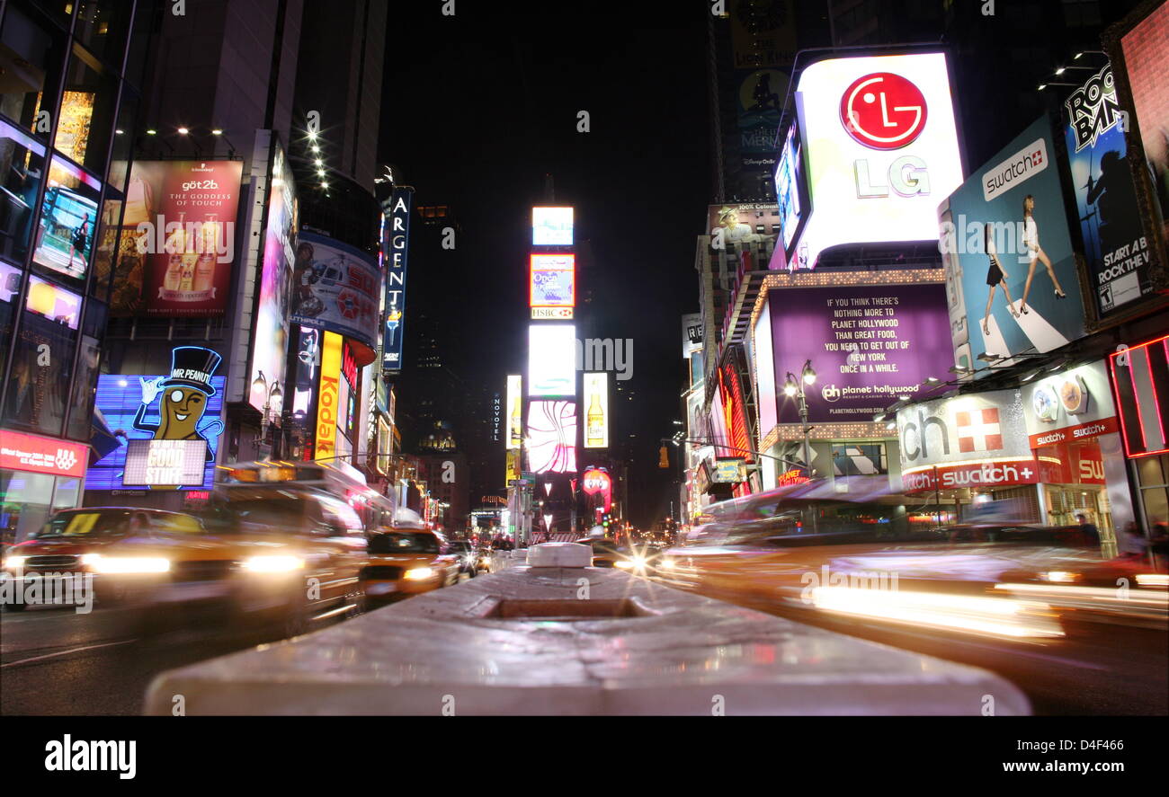 The picture shows huge advertising boards at Times Square in Manhattan ...