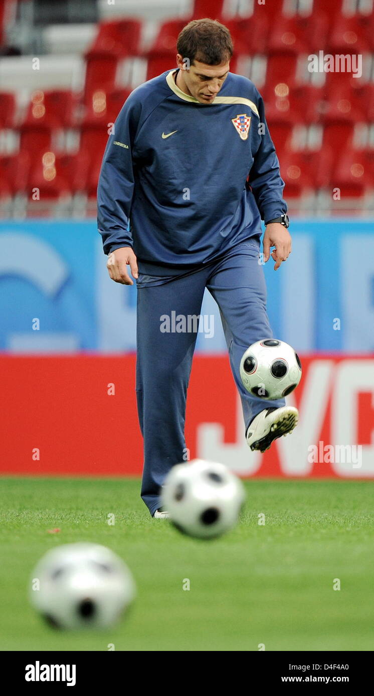 Croatian coach Slaven Bilic plays the ball during the training session ...