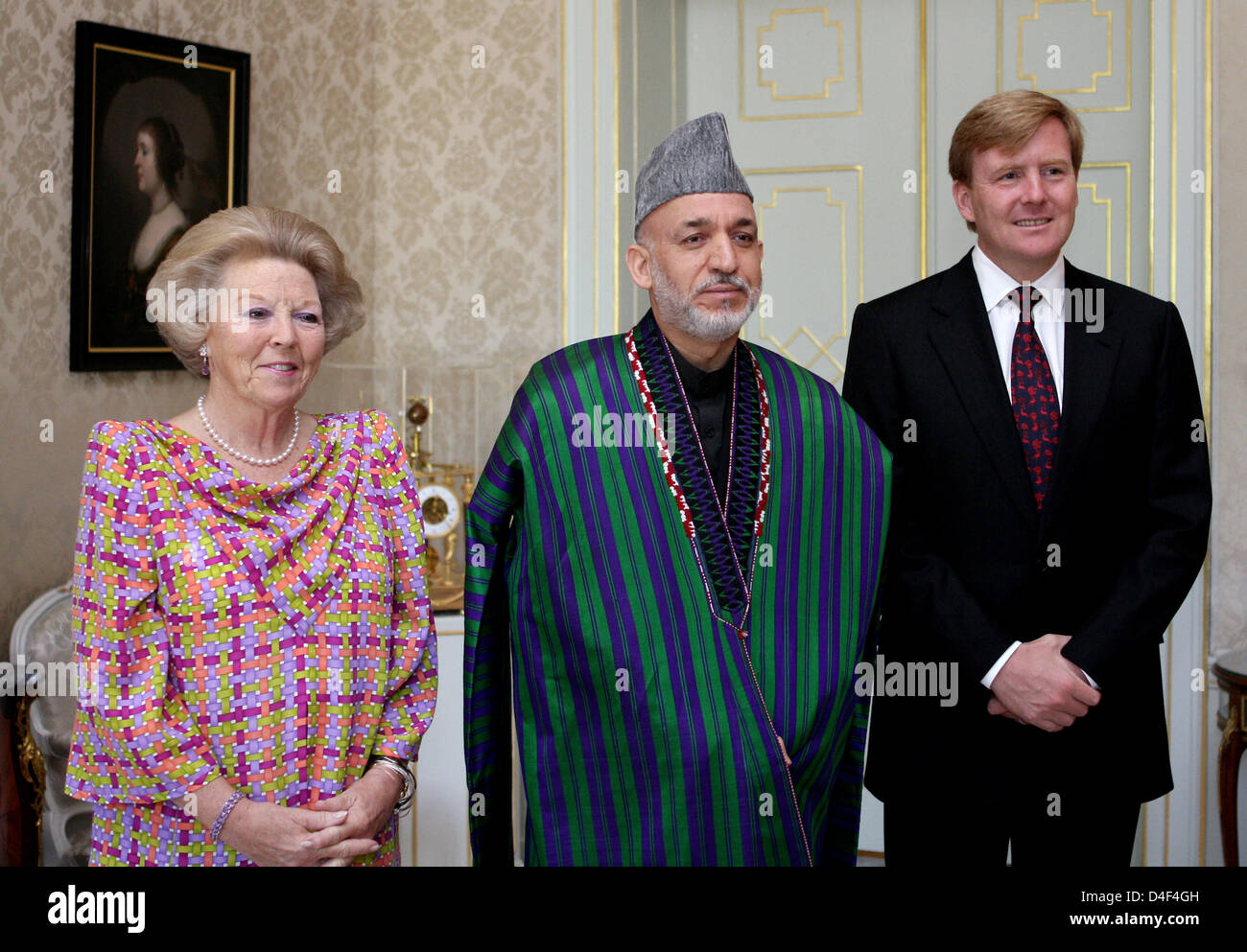 Dutch Queen Beatrix poses with Afghan President Hamid Karzai (C) and ...