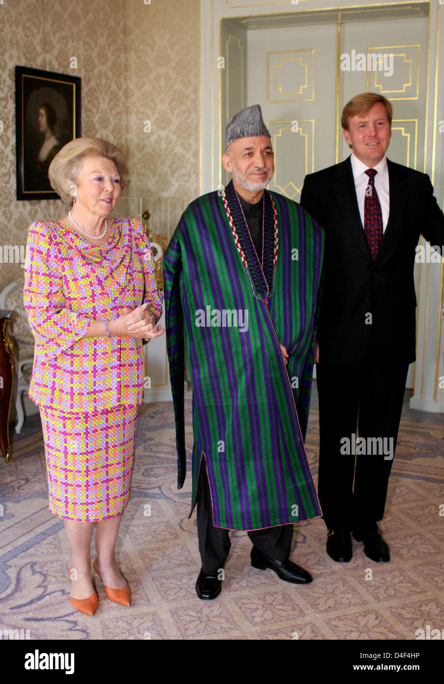 Dutch Queen Beatrix poses with Afghan President Hamid Karzai (C) and ...