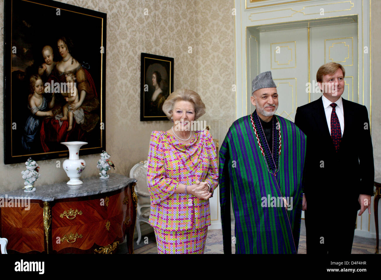 Dutch Queen Beatrix poses with Afghan President Hamid Karzai (C) and ...
