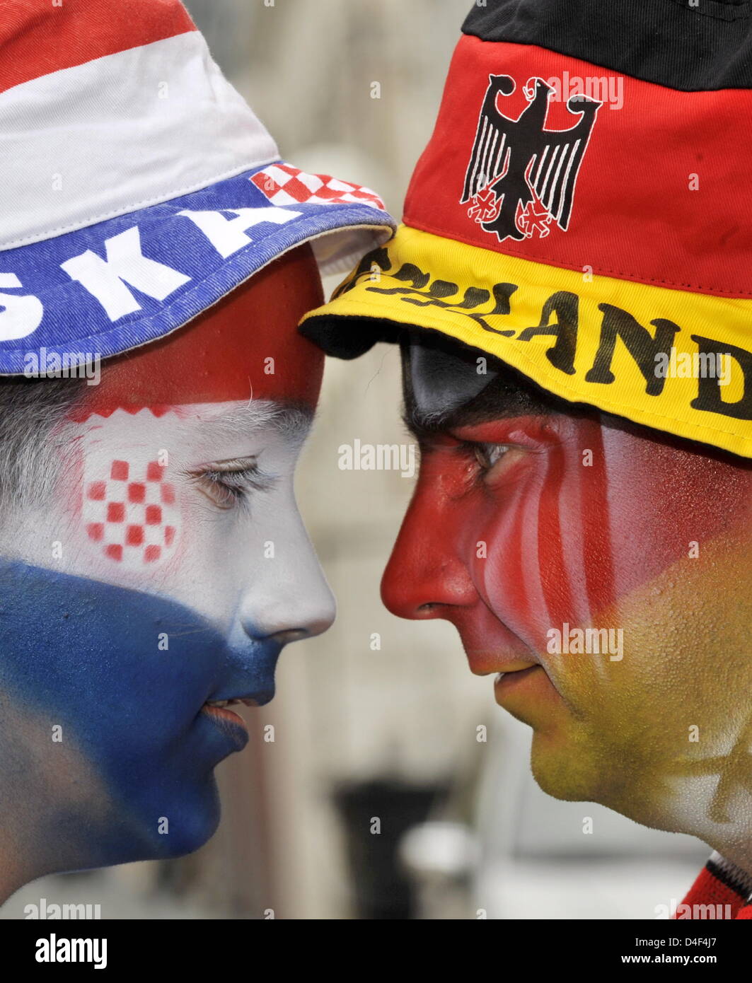 Croatian (l) and German soccer fans face each other in pre-match ...