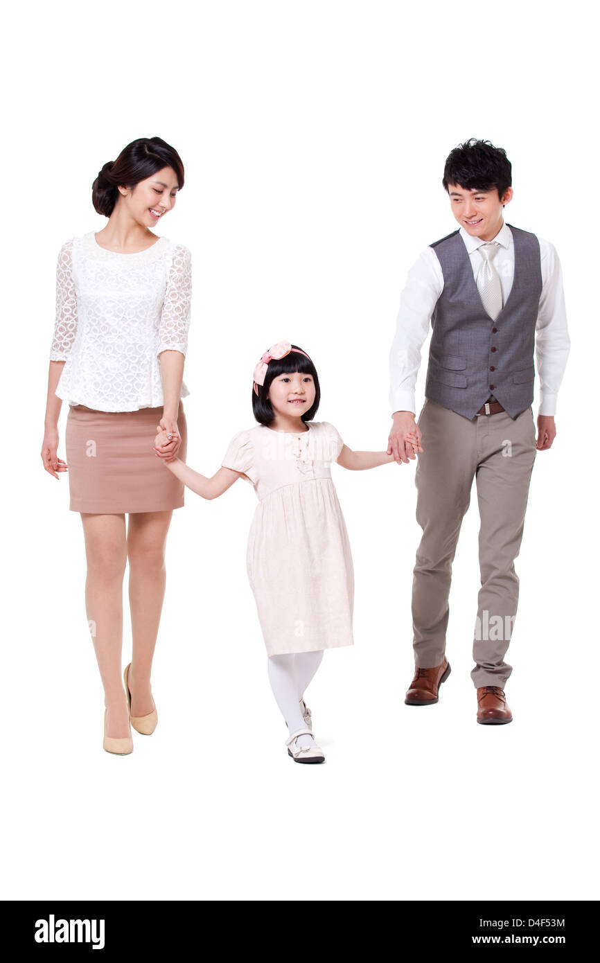 Sweet young family members hand in hand Stock Photo - Alamy