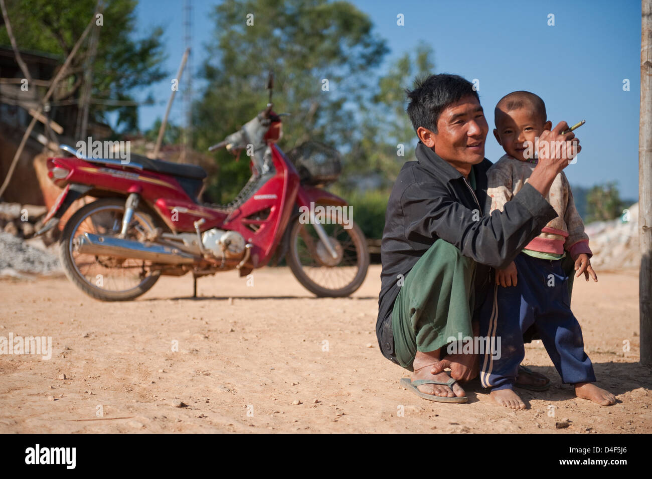 Asian father smoking outside hi-res stock photography and images - Alamy