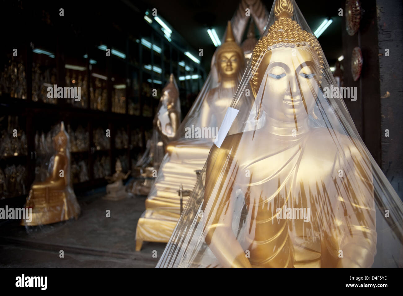 Bangkok, Thailand, packaged in plastic Buddha statue Stock Photo - Alamy