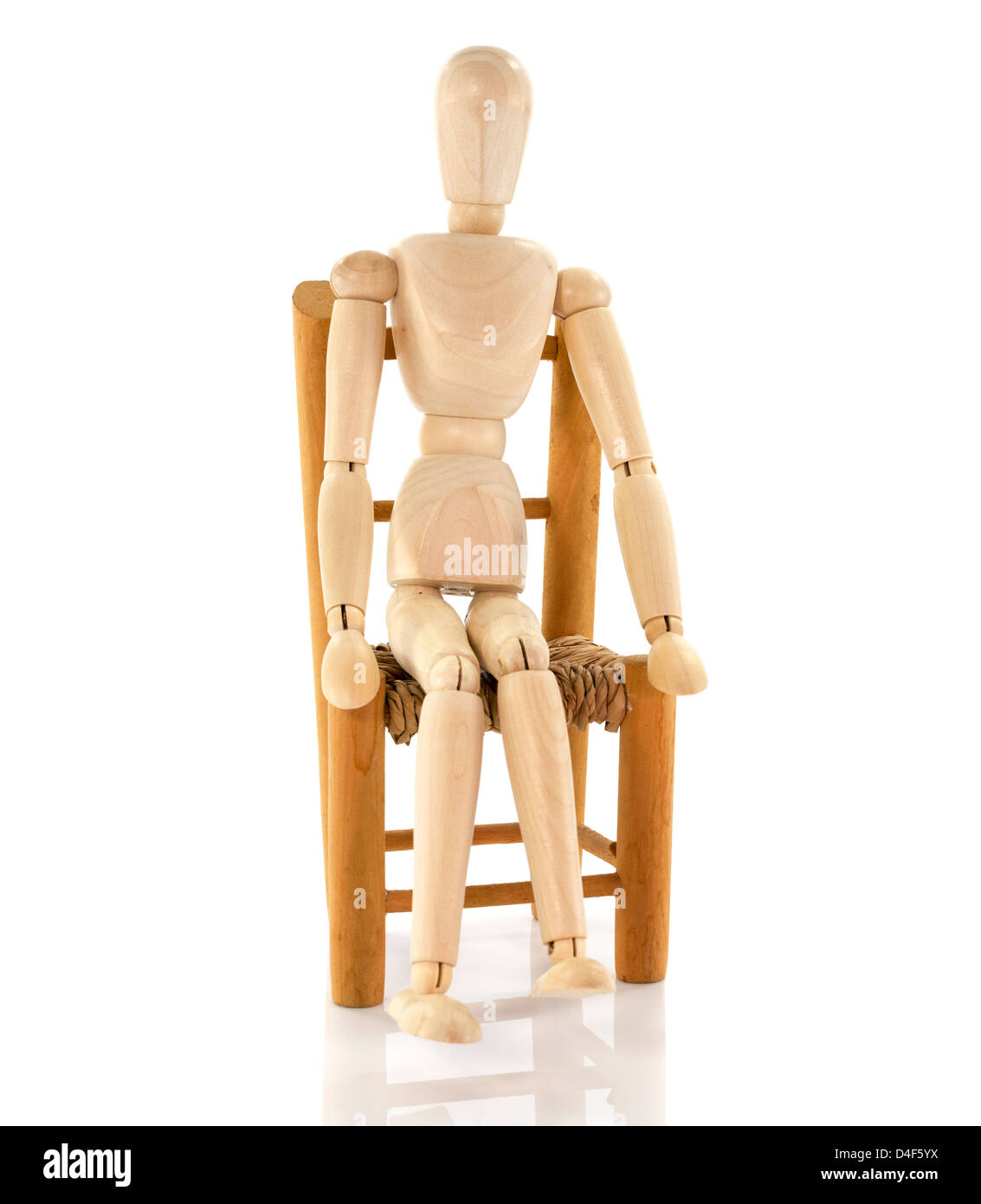 wooden puppet sitting on chair isolated on white background Stock Photo ...