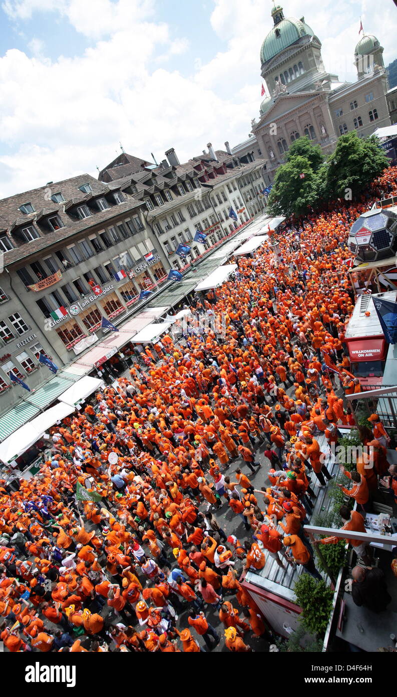 Supporter of Dutch soccer team crowd the streets in downtown Berne ...