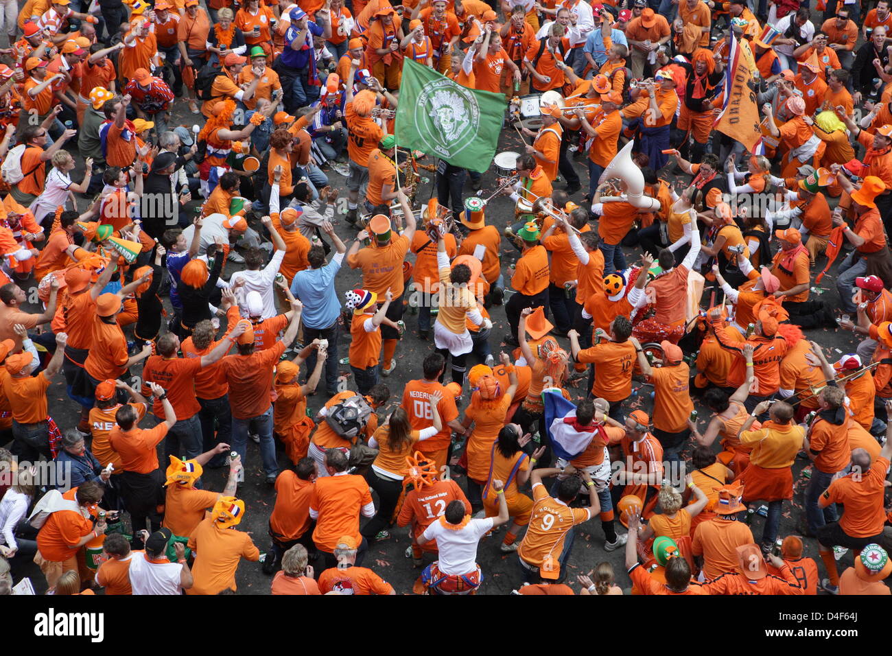 Supporter of Dutch soccer team crowd the streets in downtown Berne ...